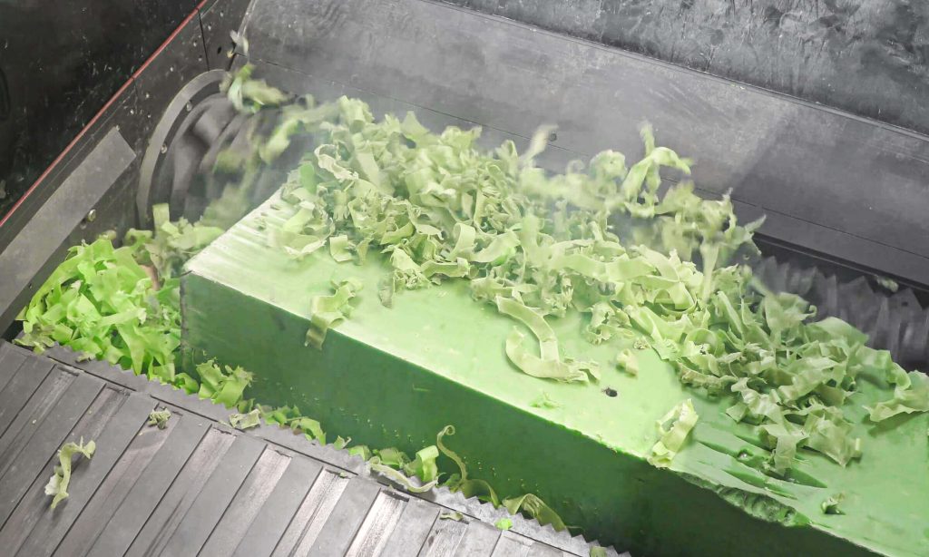 Shredding and recycling of plastic purge