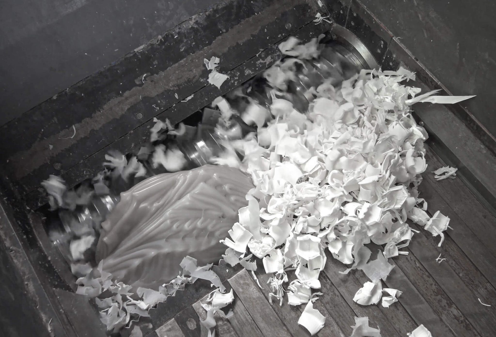 Shredding and recycling of plastic purge